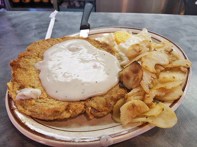The holy grail of heartland cuisine &ndash; golden-crusted chicken fried steak swimming in peppery gravy. This isn't just dinner; it's edible therapy after a long day.