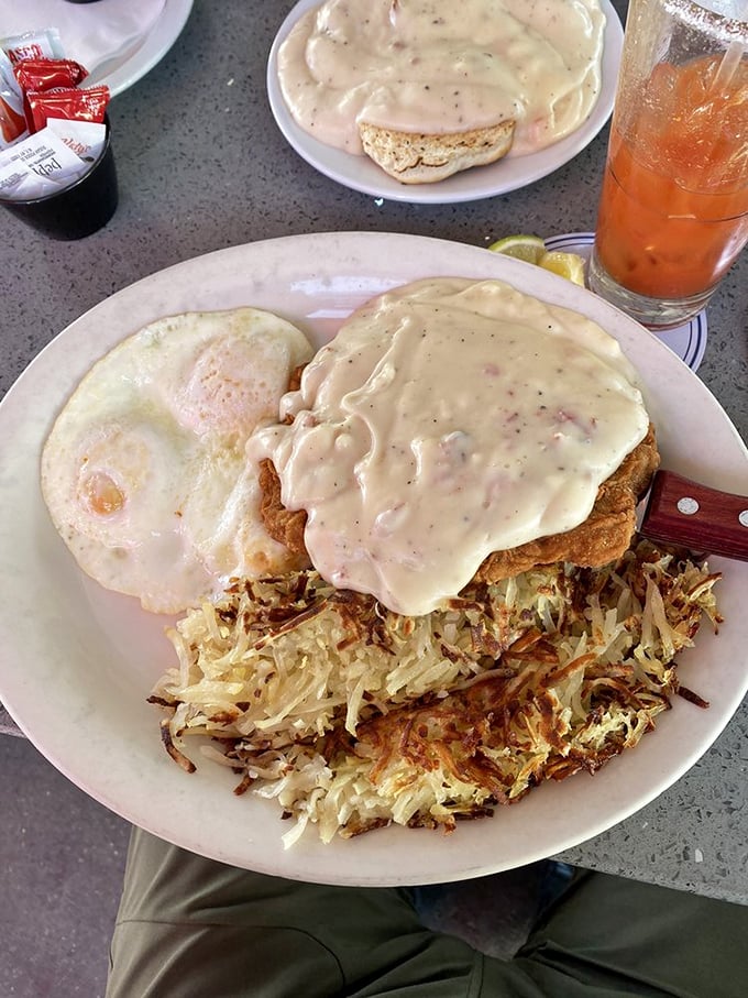 Behold the holy grail&mdash;Cappy's chicken fried steak smothered in peppery country gravy with crispy hash browns and eggs. This plate doesn't just satisfy hunger; it conquers it.