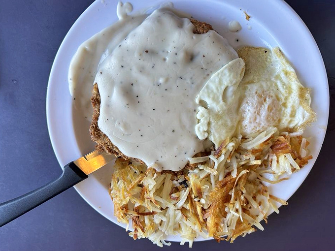 Behold the star attraction: chicken fried steak smothered in peppery gravy with eggs and hash browns. Breakfast nirvana achieved!