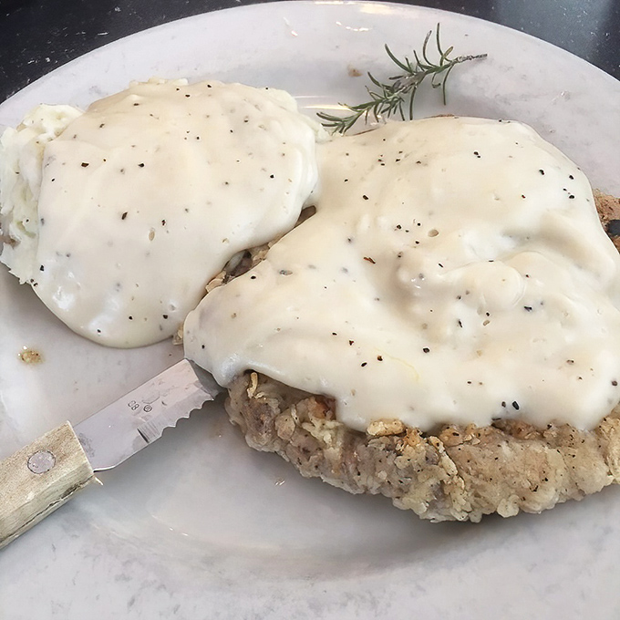 Behold the holy grail of Texas cuisine&mdash;chicken fried steak bathed in peppery cream gravy that's so good it might make you question your life choices.