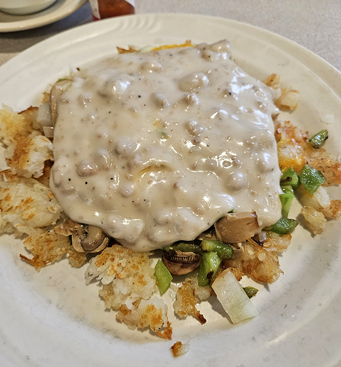 Behold the chicken fried steak in all its glory, draped in peppery gravy that dreams are made of.
