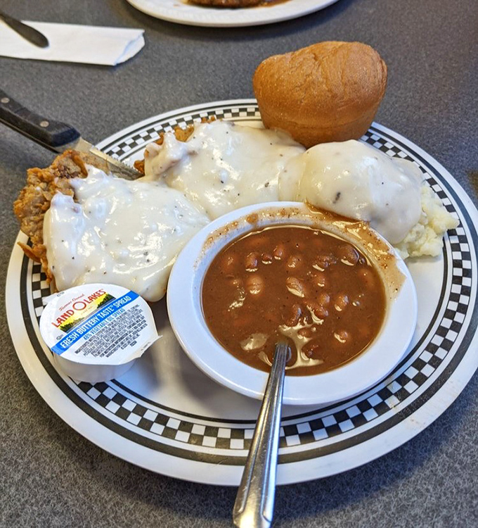 Behold the star attraction: chicken fried steak swimming in pepper gravy with sides that know their supporting role perfectly.