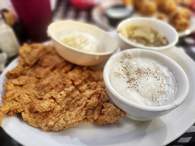 Golden-battered perfection meets peppery cream gravy &ndash; this chicken fried steak isn't just a meal, it's a religious experience for Texans.