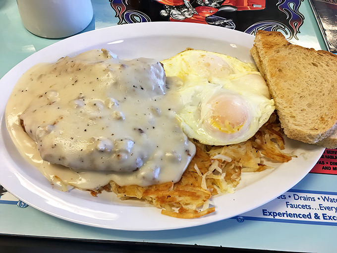 Behold the star attraction: chicken fried steak swimming in peppery country gravy, with perfectly cooked eggs and hash browns standing by for backup.