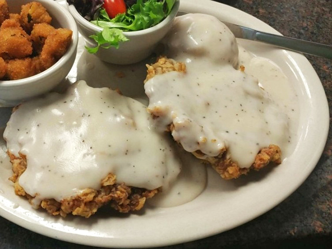 Behold the crown jewel: chicken fried steak bathed in peppery cream gravy. This isn't just dinner; it's edible therapy that makes your cardiologist weep and your soul sing.