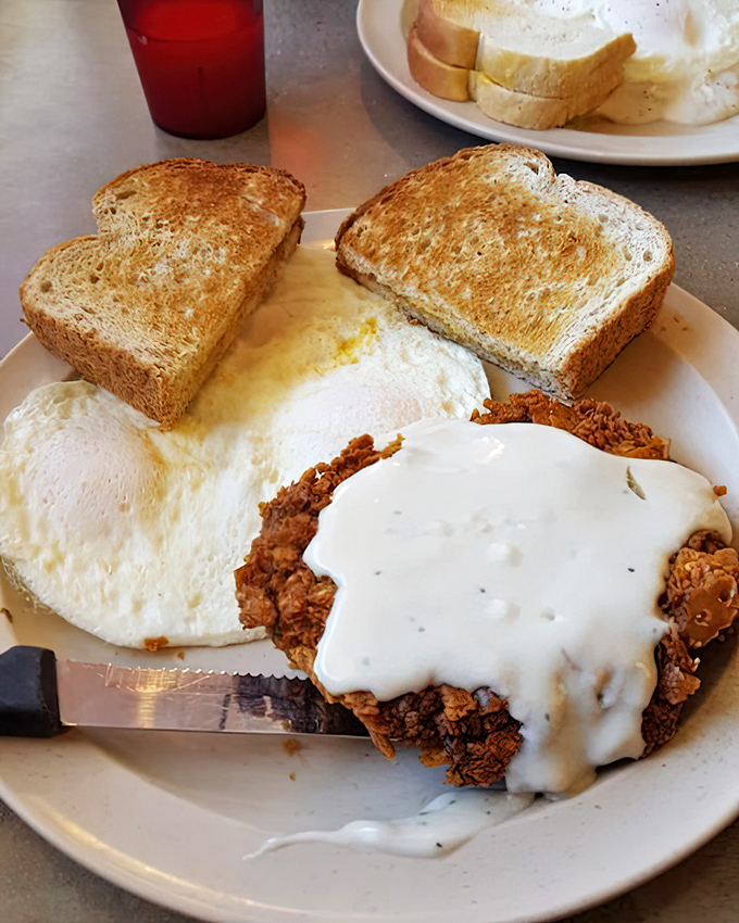 Chicken fried steak with eggs and toast&mdash;the holy trinity of diner breakfasts. That golden-brown coating shatters with each forkful, revealing tender meat beneath.