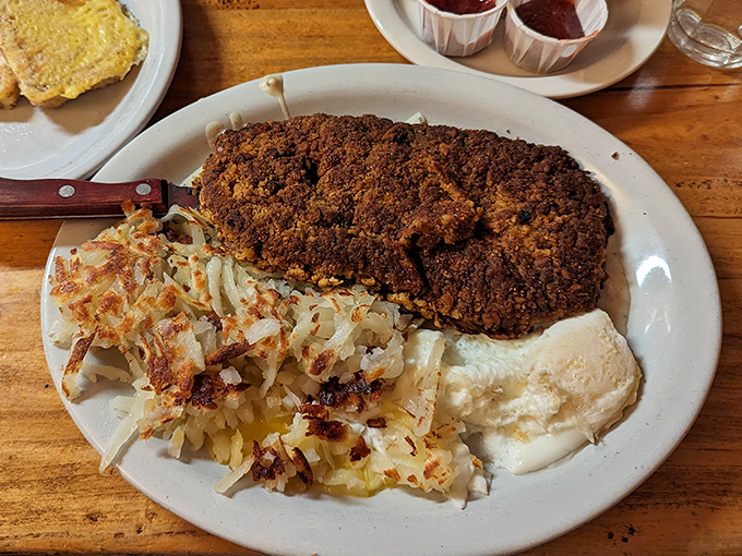 Behold the legendary chicken fried steak &ndash; a crispy, seasoned exterior giving way to tender meat, with hash browns that achieve the perfect crisp-to-fluffy ratio.