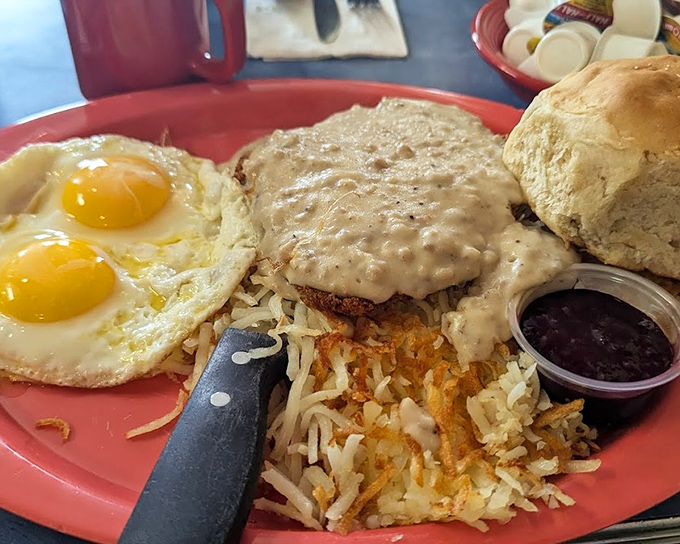 The star of the show: chicken fried steak swimming in gravy with sunny-side-up eggs standing guard. Breakfast nirvana achieved.