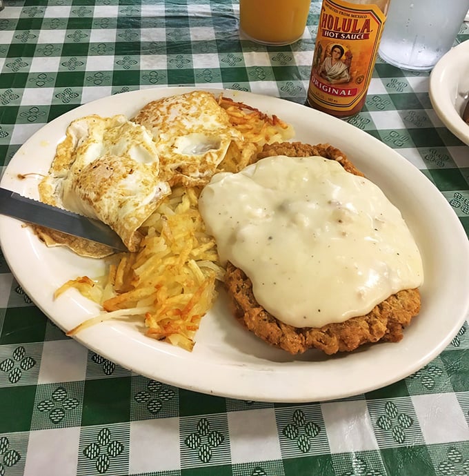 Behold the star attraction: chicken fried steak smothered in peppery country gravy with eggs and hash browns that could make a grown adult weep.