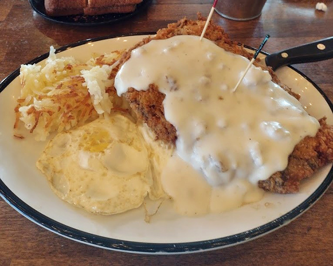 Behold the holy trinity of diner perfection: golden chicken fried steak, creamy gravy, and hashbrowns that mean business.