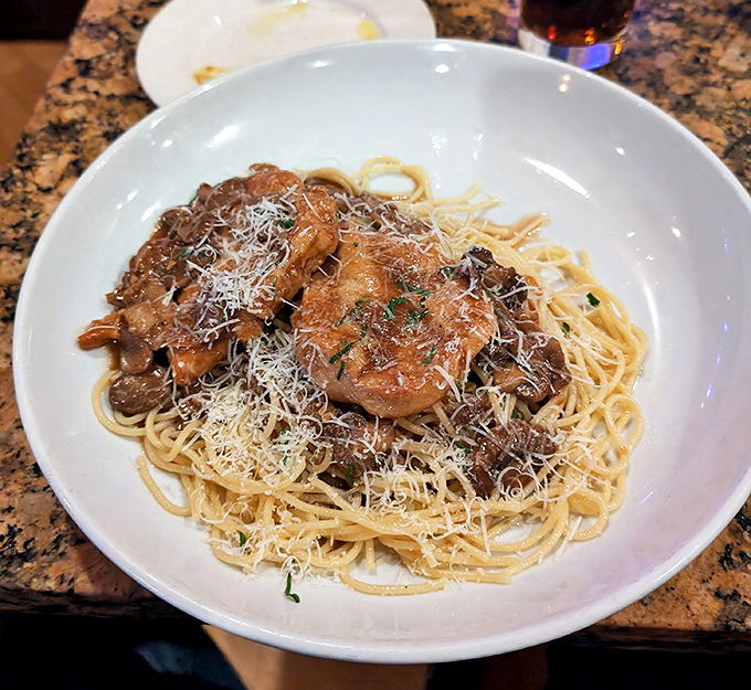 Behold the star attraction: tender chicken and earthy mushrooms swimming in Marsala sauce that would make even your Italian grandmother weep with joy.