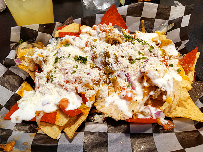Behold the chicken nachos in all their glory&mdash;crispy chips buried under toppings that would make your cardiologist nervous and your taste buds ecstatic.