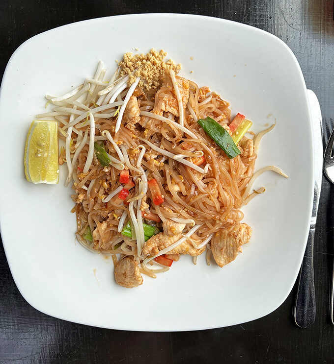 Behold the star of the show&mdash;Chicken Pad Thai that's achieved celebrity status in Alexandria. That lime wedge isn't just garnish, it's the final puzzle piece.