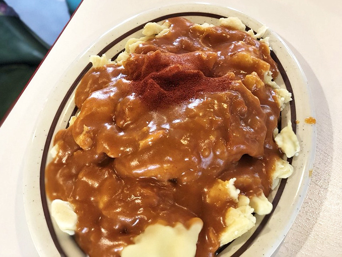 This isn't just gravy&mdash;it's a paprika-kissed masterpiece cascading over dumplings that have been soaking up delicious secrets for generations.