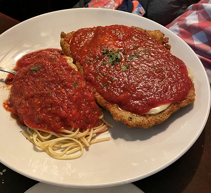 Behold the chicken parm in all its glory &ndash; a masterpiece of crispy, saucy, cheesy perfection that makes you want to cancel all other dinner plans forever.