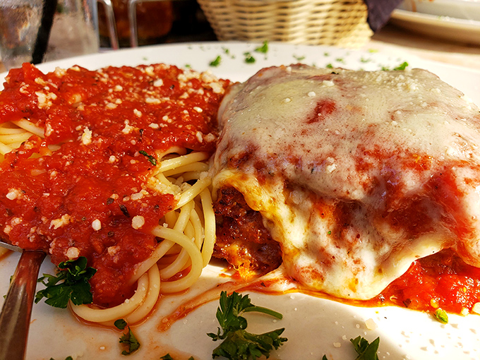The legendary chicken parmesan in all its glory &ndash; a perfect trinity of crispy breading, tangy marinara, and melted cheese that dreams are made of.
