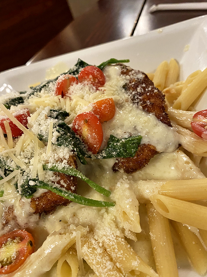 Golden-brown chicken parmesan that makes angels sing, topped with fresh tomatoes and spinach over perfectly al dente pasta. Comfort food that graduated with honors.