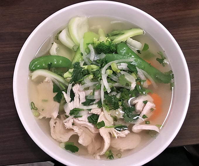 Golden broth, tender chicken, fresh herbs, and those perfect rice noodles swimming together in pure Vietnamese comfort food heaven right here.