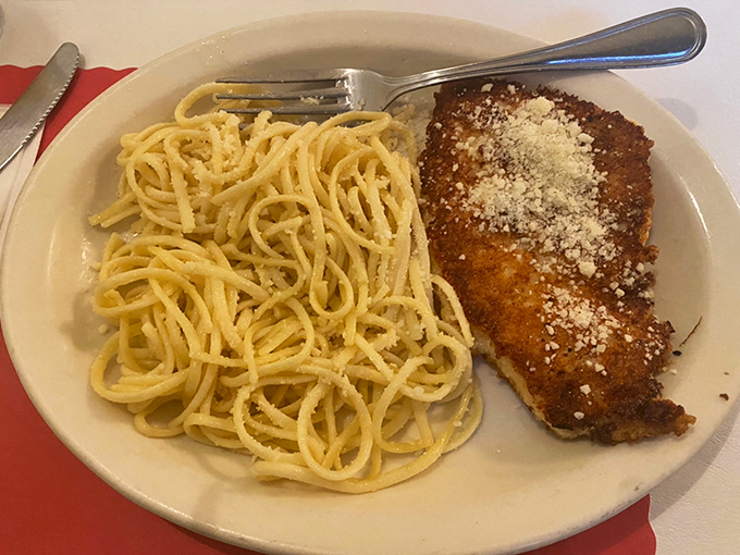 This chicken cutlet with spaghetti isn't trying to reinvent Italian cuisine&mdash;it's perfecting it with a generous dusting of Parmesan that means business.