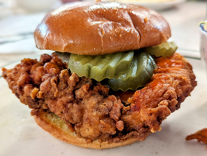 The chicken sandwich that launched a thousand cravings. That pickle isn't just garnish&mdash;it's the perfect acidic counterpoint to the crispy, golden-brown perfection beneath it.