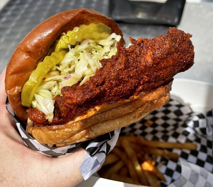 Behold the sandwich that launches a thousand cravings&mdash;crispy, fiery chicken nestled with cooling slaw and pickles between a pillowy bun. Poetry in sandwich form.