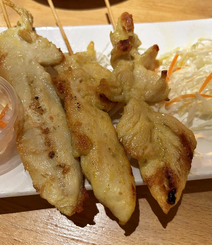 Chicken satay that would make Bangkok street vendors nod in approval. Those grill marks aren't just decoration&mdash;they're flavor tattoos.