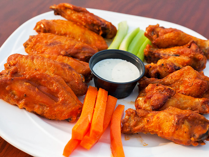 These wings aren't just cooked&mdash;they're transformed. Crispy outside, juicy inside, with celery and carrots standing by like loyal sidekicks to a superhero.