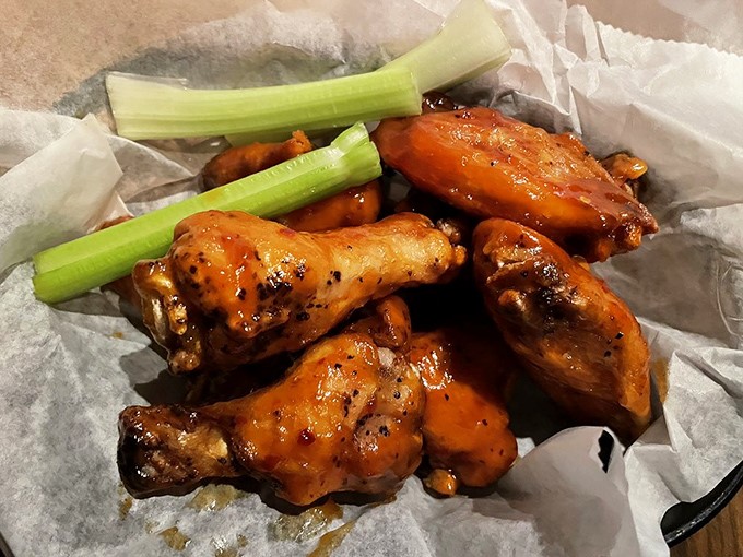 These wings aren't just food; they're a religious experience. Glistening with sauce, perfectly crisp, with celery standing by for moral support.
