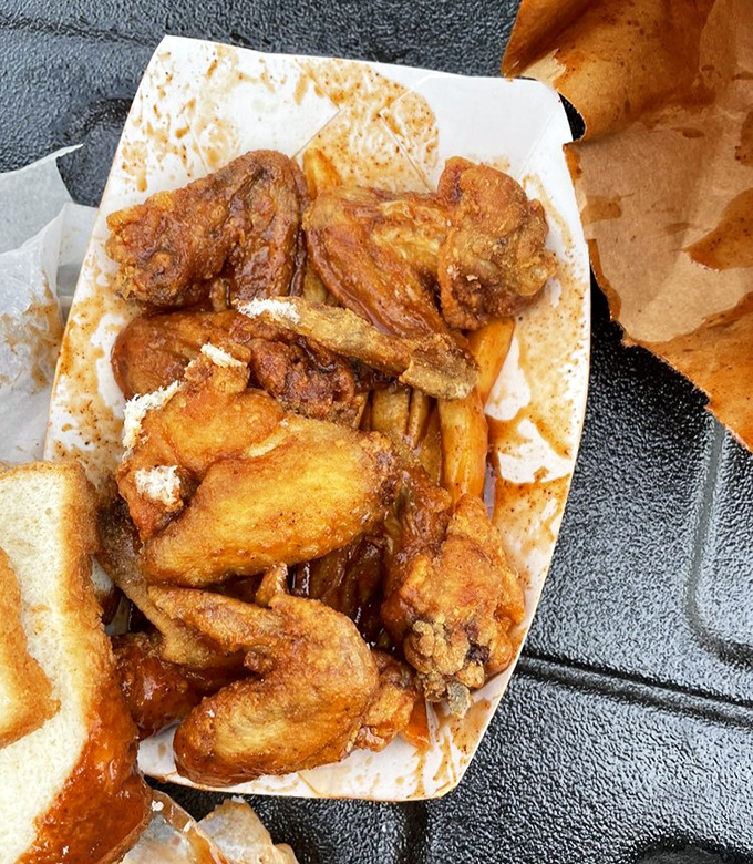 Golden-fried chicken wings that crackle with each bite. The kind of crispy perfection that makes you forget table manners exist.