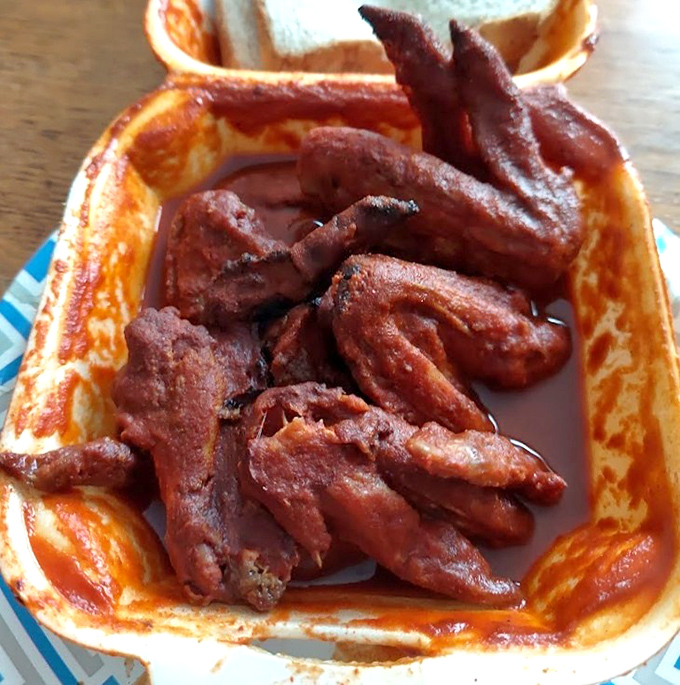 These wings aren't just cooked, they're transformed&mdash;baptized in smoke, glazed in that signature sauce, and ready for their close-up.