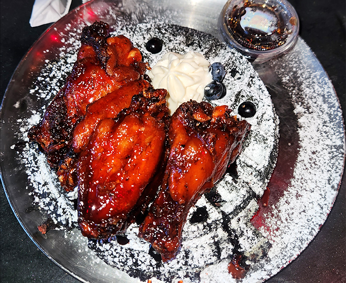 These aren't just wings; they're a masterclass in sweet-heat balance. The glistening sauce clings to perfectly crisp skin, making these birds worth crossing the road for.