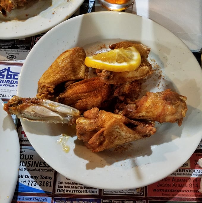Golden-fried wings with a lemon garnish&mdash;because sometimes the simplest pleasures are the ones that make you close your eyes and sigh.