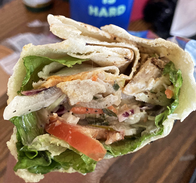 This chicken wrap isn't just lunch&mdash;it's architectural brilliance. Fresh ingredients stacked with the precision of a Jenga master who really knows their stuff.