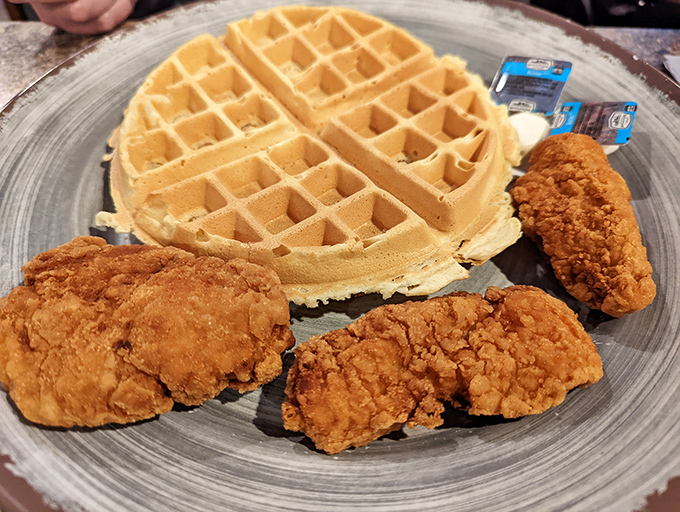 The holy grail of comfort food pairings! Golden-brown chicken with audaciously crispy skin meets a waffle that's practically begging for maple syrup.