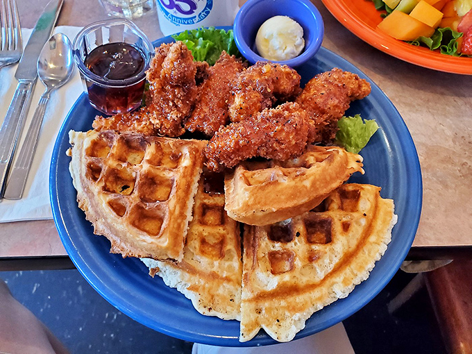 The holy grail of breakfast unions. Golden waffles supporting crispy chicken like a throne, with maple syrup standing by for its coronation moment.