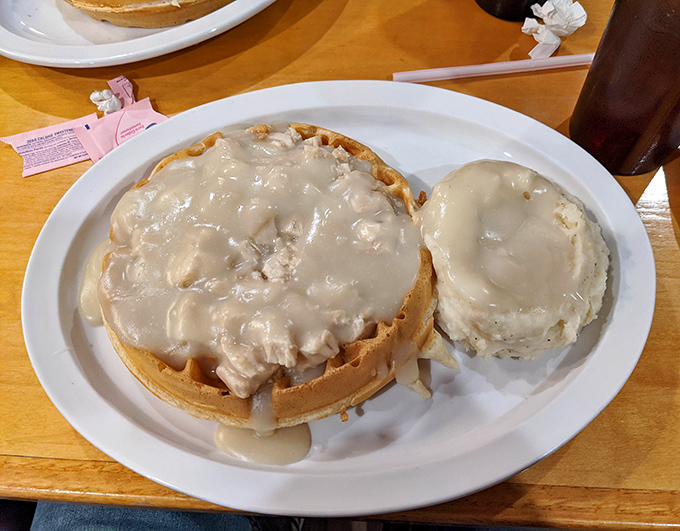 The infamous chicken and waffles – where crispy meets fluffy, savory meets sweet, and your diet plan meets its temporary demise.