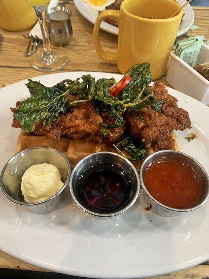 Behold the main event: crispy fried chicken crowned with kale, ready to change your life.