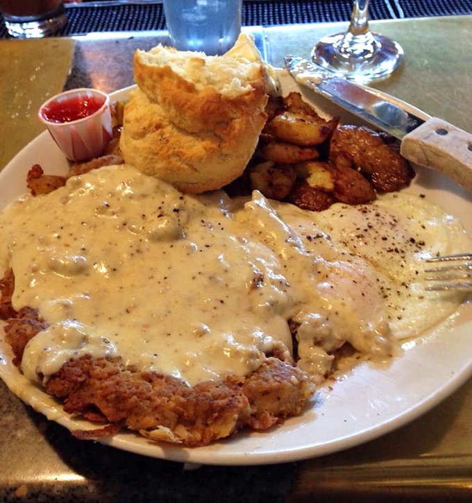 Behold: the legendary chicken fried steak in all its glory. That gravy doesn't merely cover&mdash;it embraces, like a warm hug from your favorite aunt.
