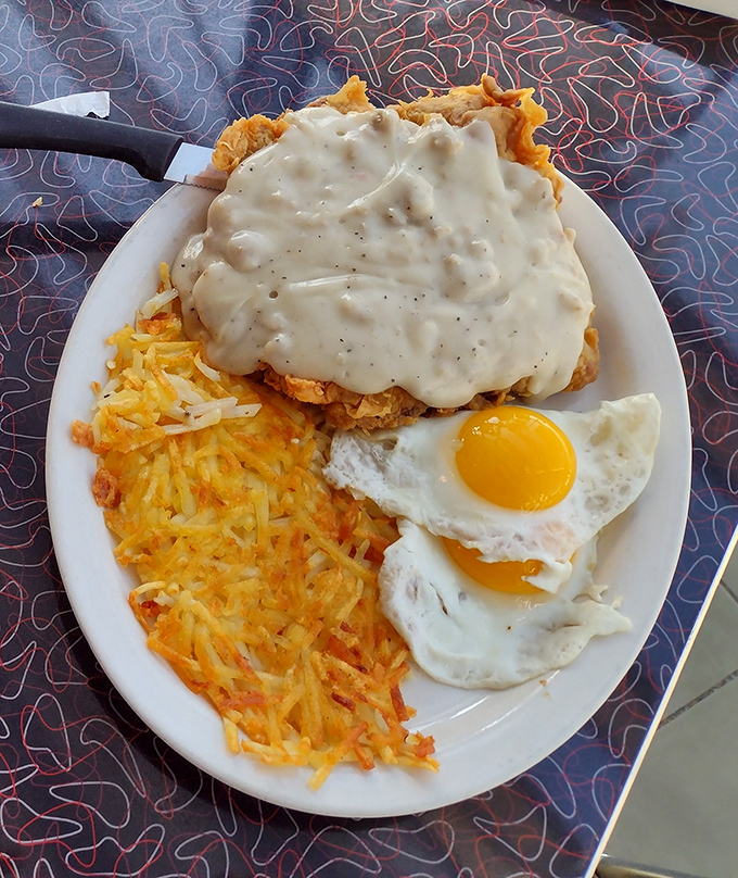 This isn't just breakfast&mdash;it's edible architecture. Golden hash browns, perfectly fried eggs, and chicken fried steak smothered in gravy that would make your grandma jealous.