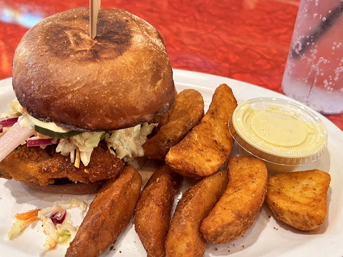 The sandwich that launched a thousand cravings. Golden-brown chicken, fresh slaw, and those perfectly seasoned jo-jos make a plate of pure joy.
