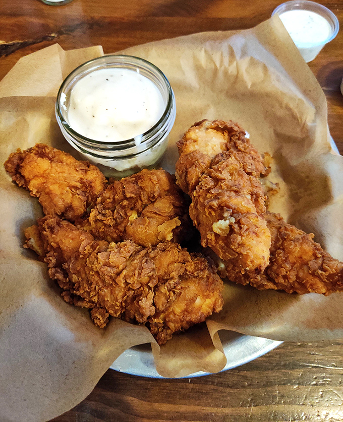 These aren't just chicken strips; they're golden-brown masterpieces of crunch and tenderness that make you question why you ever ate anywhere else.