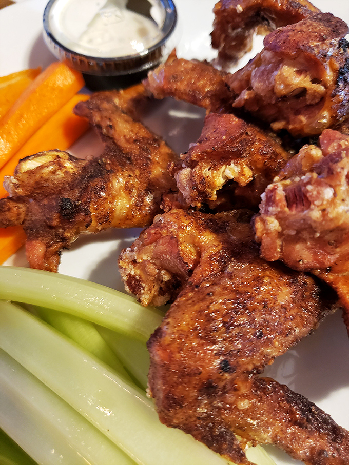 These wings aren't just crispy, they're life-changing – perfectly smoked, fried to golden perfection, and served with veggies that somehow don't feel like an afterthought.