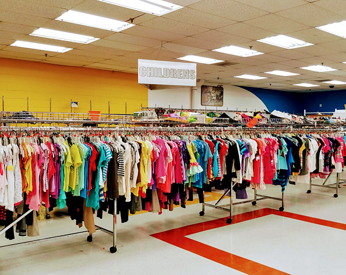 The children's section explodes with color like a kindergarten art project, offering outfits kids will outgrow before they can stain them.