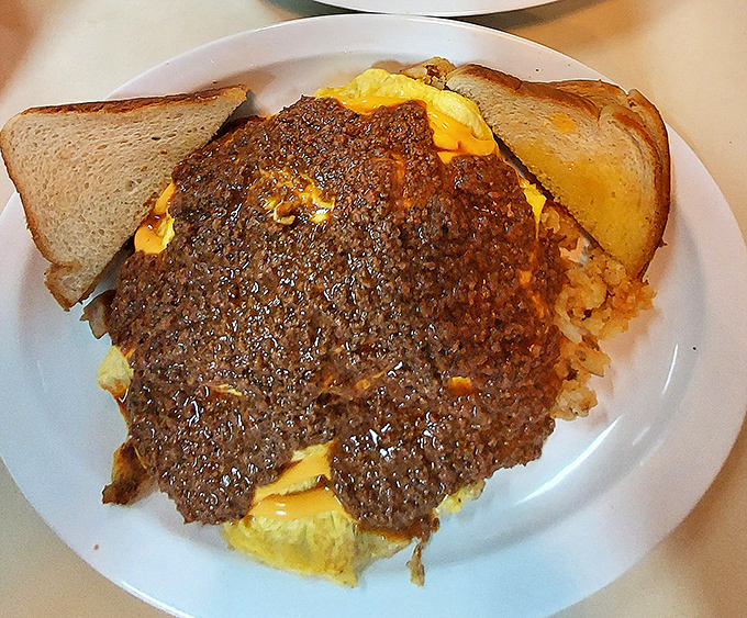 This isn't just chili – it's a Greek-influenced meat sauce that's been perfecting its relationship with eggs and toast for decades. Breakfast nirvana!