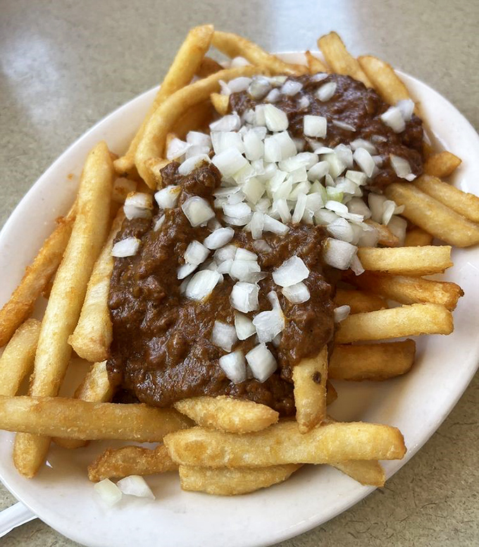 Chili fries that don't apologize for being exactly what they are: a glorious mess of comfort that demands both fork and napkin commitment.