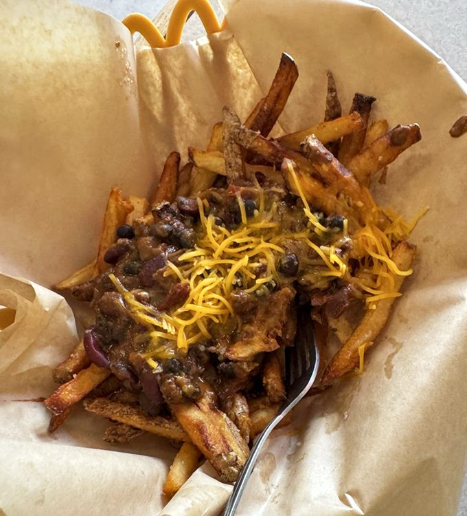 Behold the legendary chili cheese fries&mdash;where crispy potatoes somehow maintain their dignity under a blanket of meaty, cheesy magnificence.