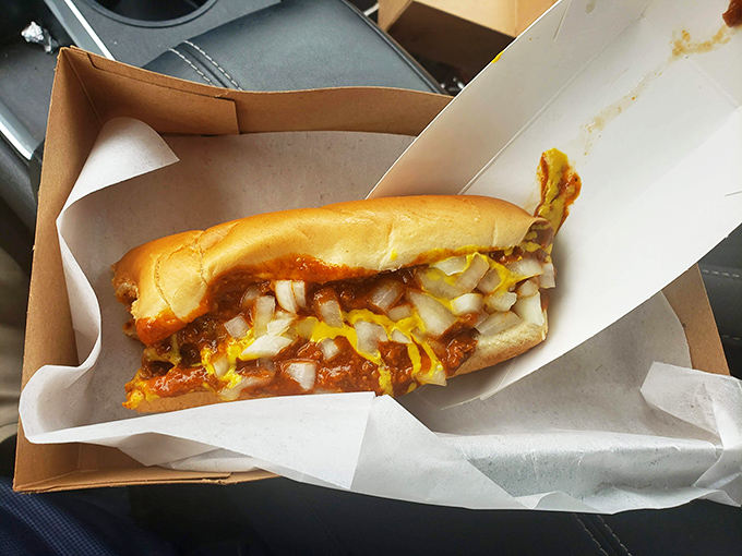 A chili dog that looks like it means business, no nonsense, just pure comfort on a bun.