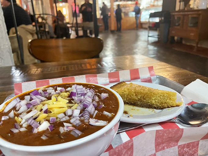 Heaven in a bowl! Old World Deli's legendary chili comes topped with a mountain of diced onions and shredded cheese, alongside golden cornbread that's begging to be dunked.