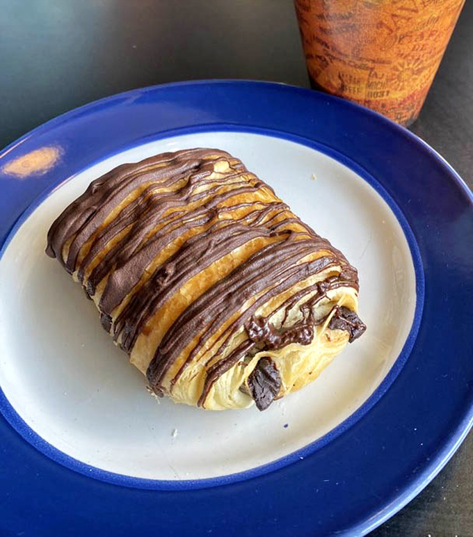 Not just any chocolate croissant &ndash; this is what breakfast dreams are made of, with chocolate drizzle that belongs in an art museum.