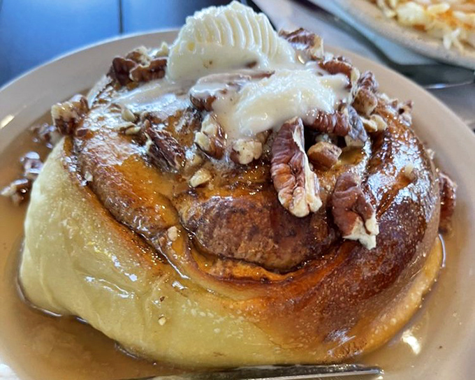 This isn't just a cinnamon roll&mdash;it's a spiritual experience with butter, pecans, and enough gooey goodness to make you weep with joy.